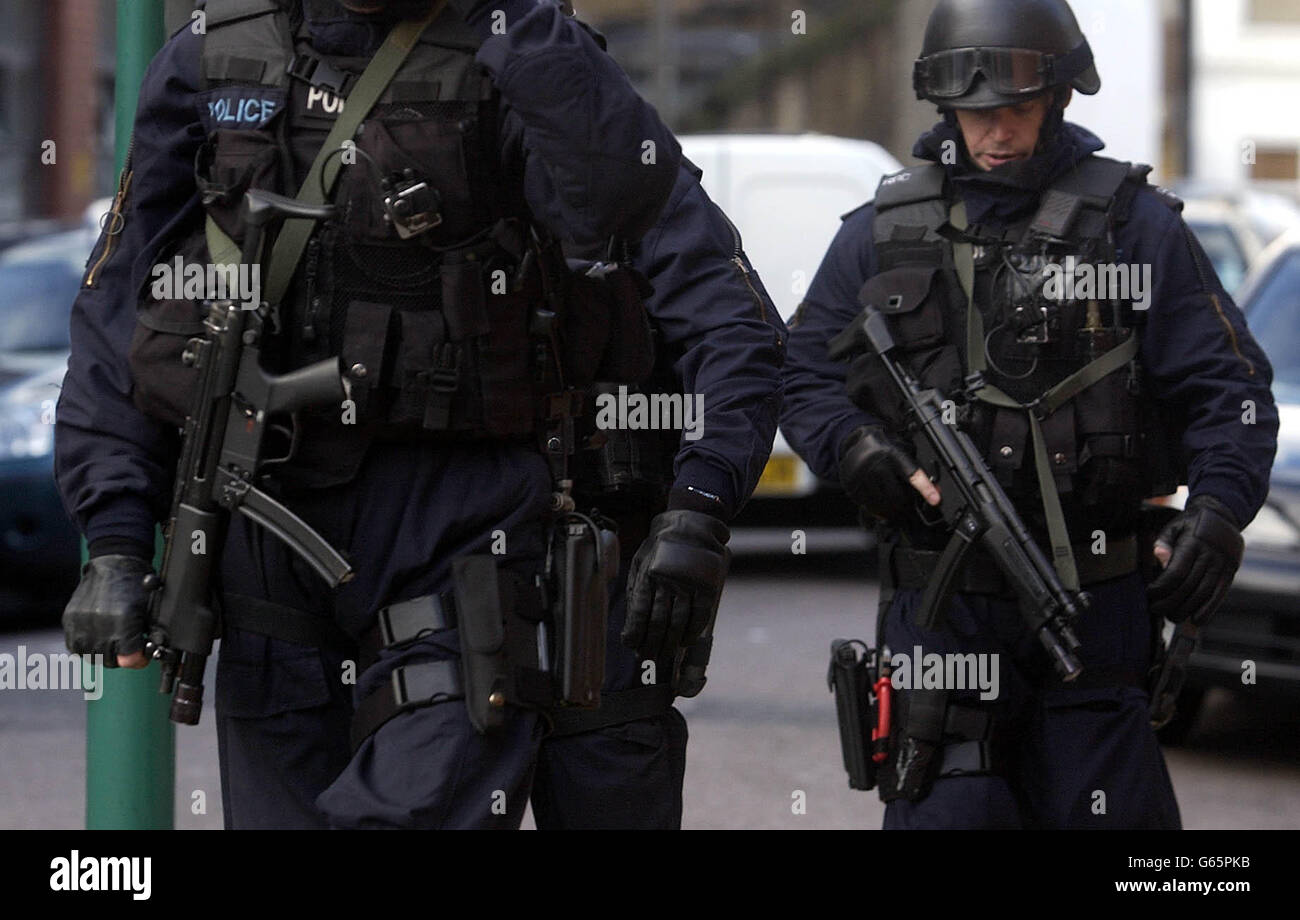 Armed police officers on the streets of Hackney, East London. The ...