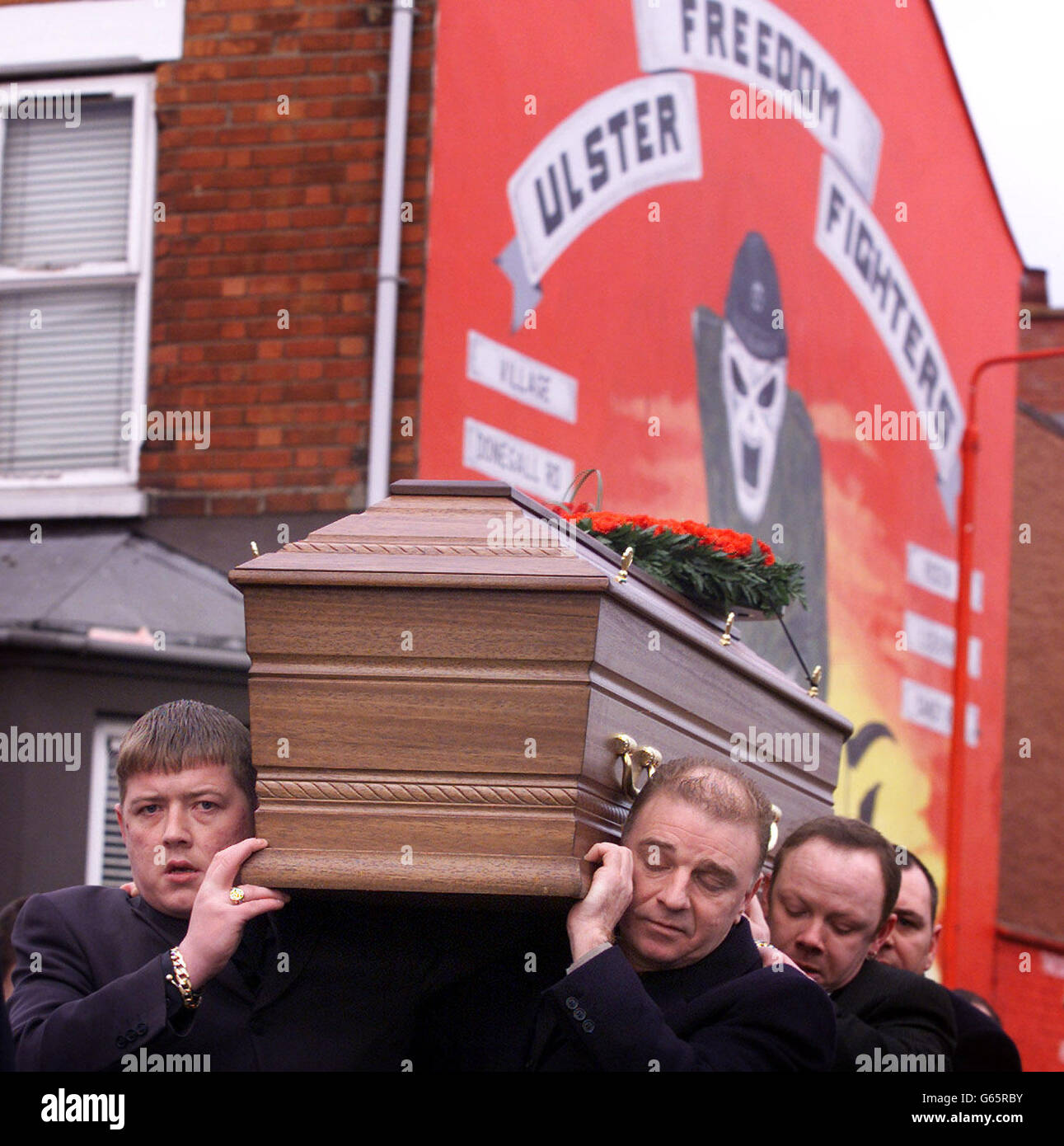 The coffin of Roy Greene, 32, passes a Ulster Freedom Fighters (UFF ...