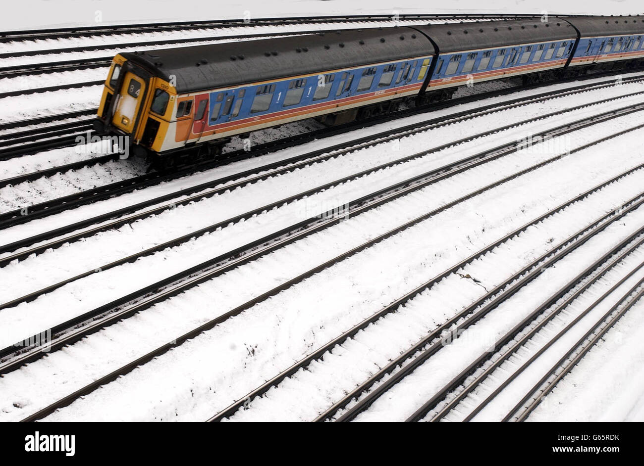 A train runs despite icy conditions in central London. Network Rail ...