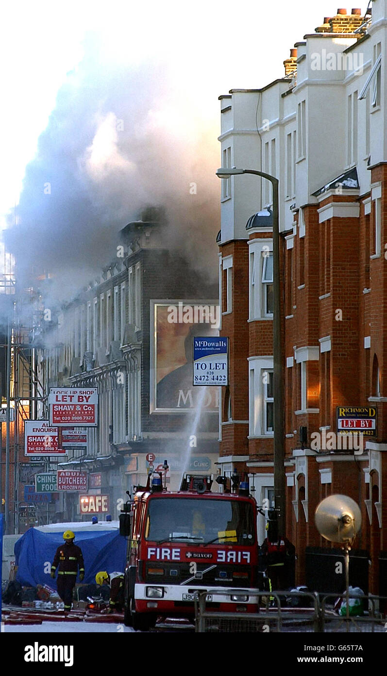 Firemen tackle a blaze from the house at the centre of the siege in ...