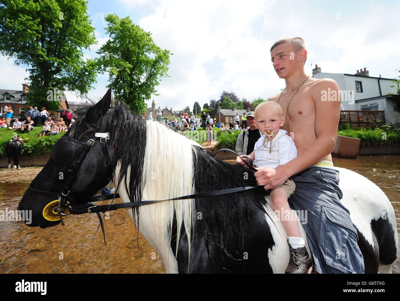 Jeff Nesham, 16, and 18 month old David Briganti, from Gateshead ride ...