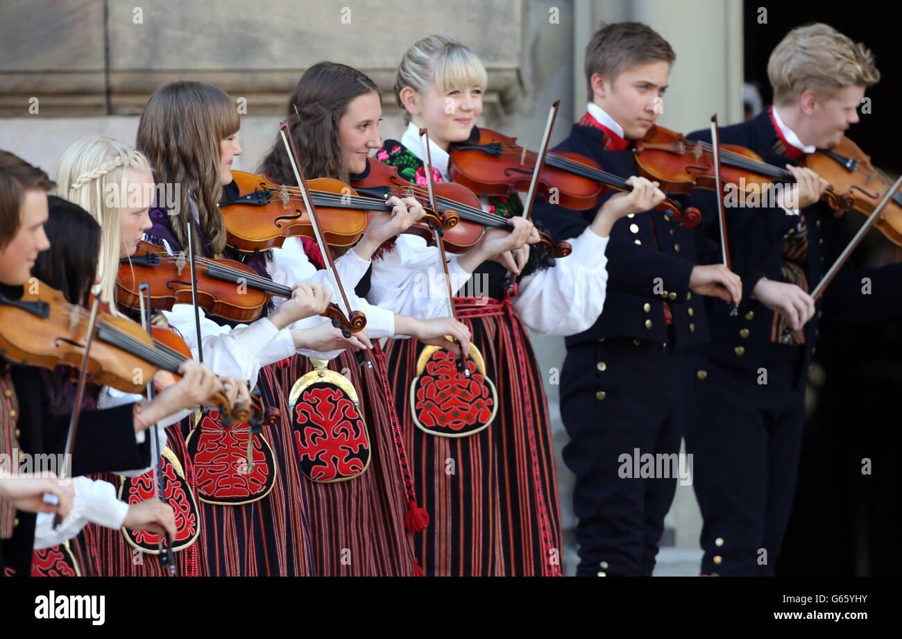 Musicians play outside the Royal Palace ahead announcing the arrival of ...