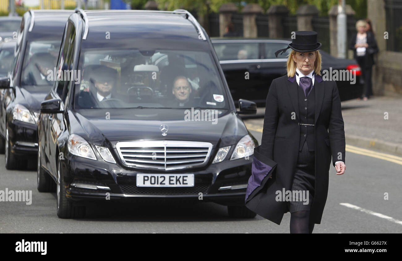 Two hearse carrying the coffins of Margaret McDonough and her daughter ...