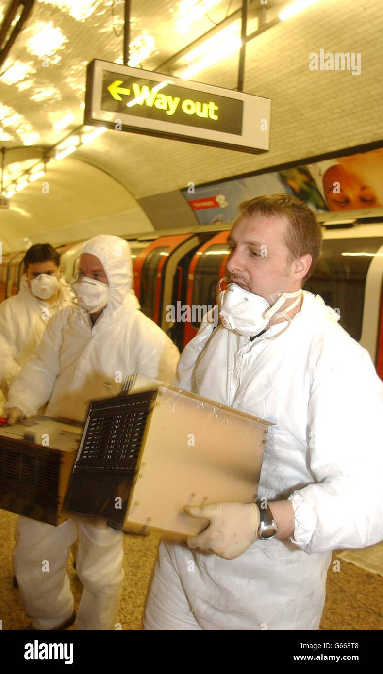 Engineers remove material from the wreckage of the tube train at ...