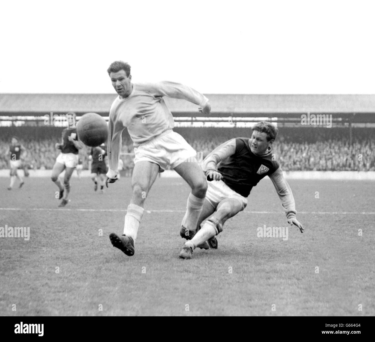 Bobby Kennedy, the Manchester City full-back, challenging Brian Dear of ...