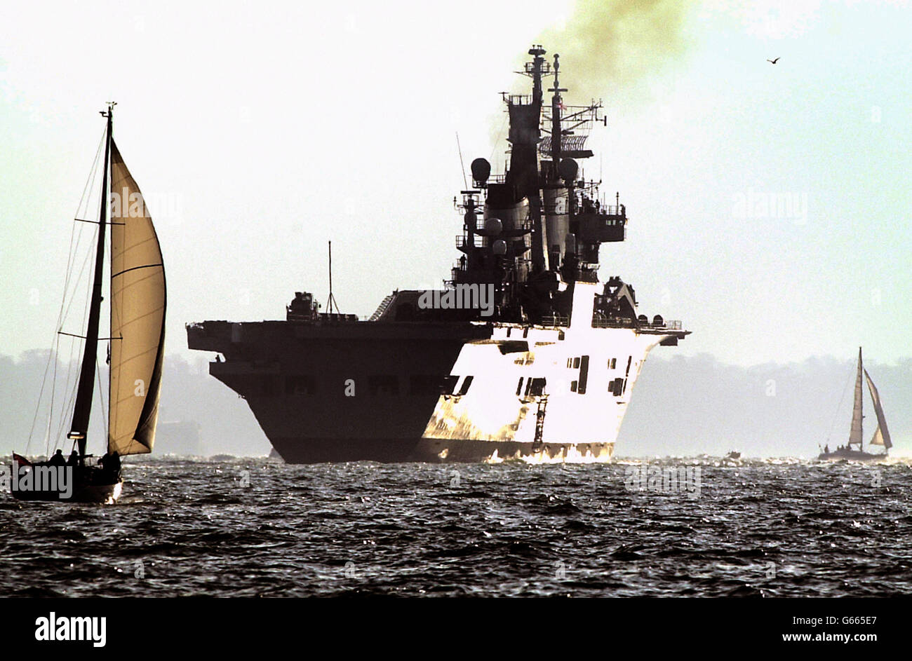 The aircraft carrier HMS Ark Royal leaving Portsmouth Harbour, to begin ...