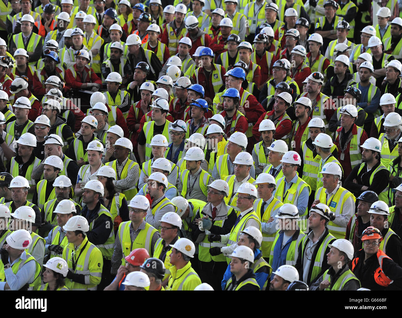 Workers gather together in the departures hall of Heathrow's Terminal 2 ...