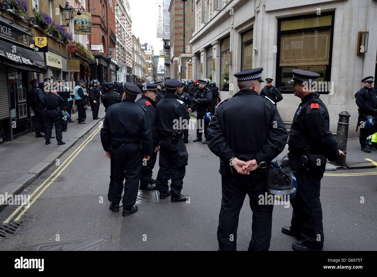 Police officers on duty in Soho, central London, where protesters with ...