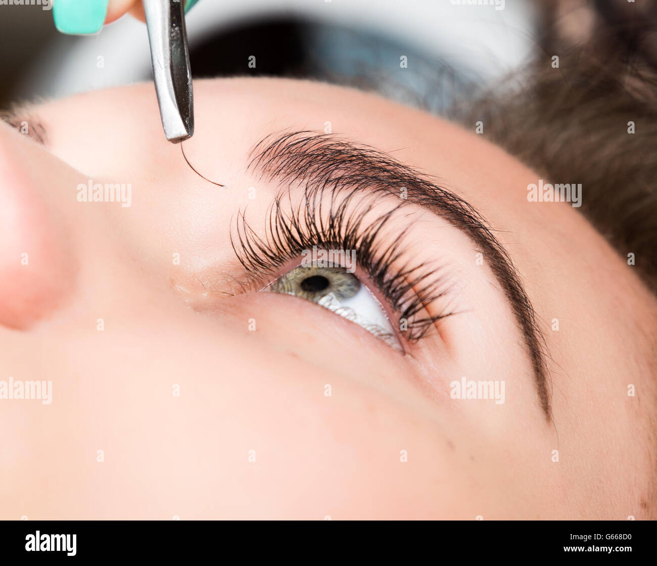 Beautiful young woman eyelash extension. Woman eye with long eyelashes ...
