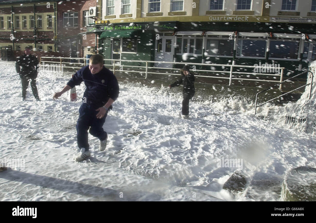 Gale force winds and high seas turn the waves pounding Whitby harbour ...
