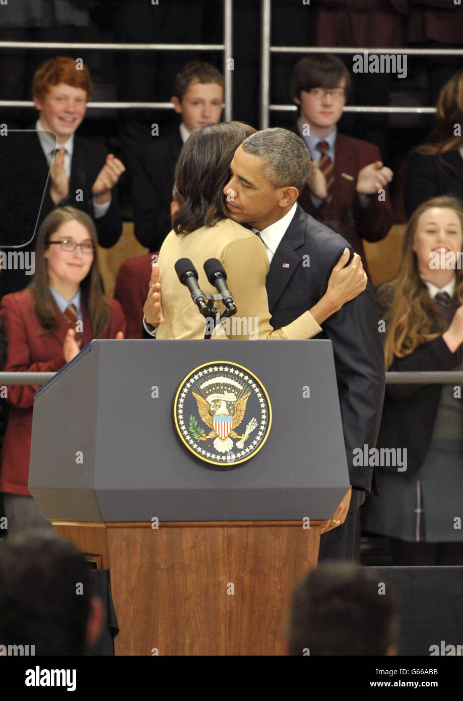 US President Barack Obama hugs his wife Michelle Obama, before ...