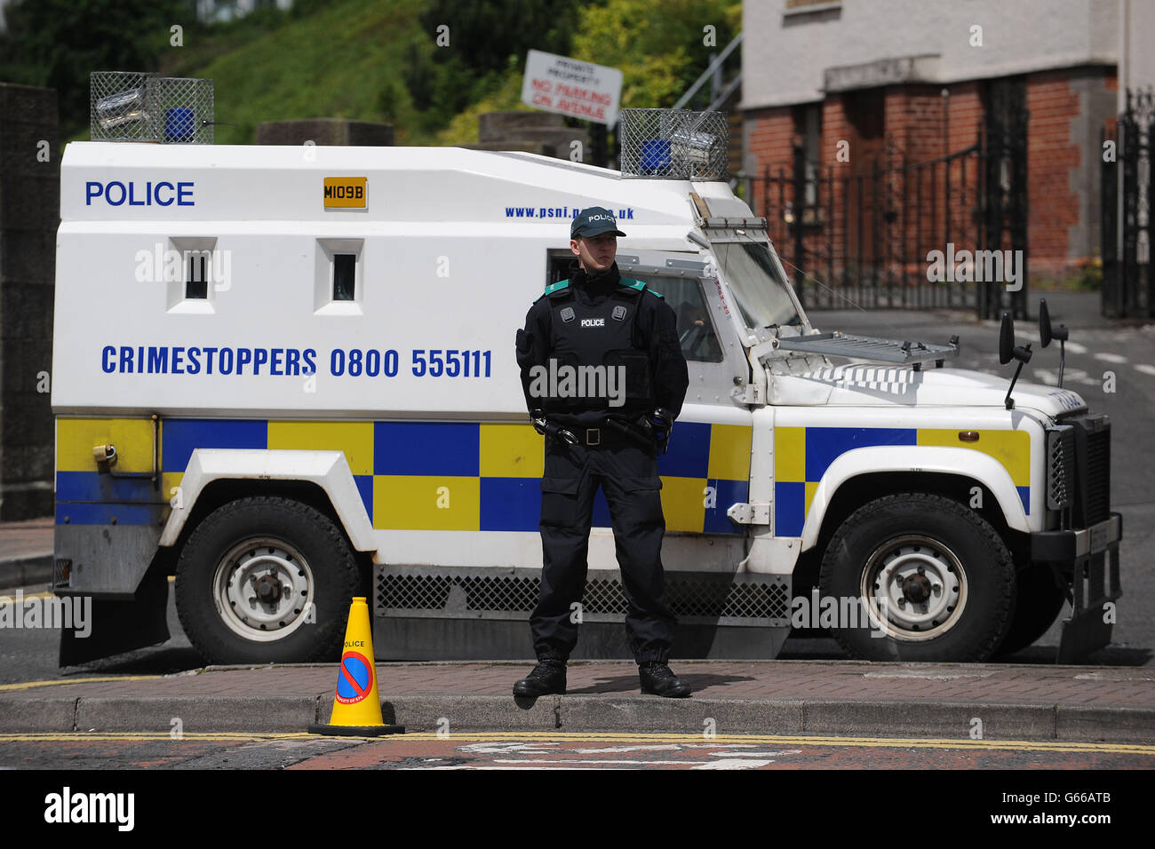 A member of the PSNI stands guard at the war memorial in Enniskillen in ...
