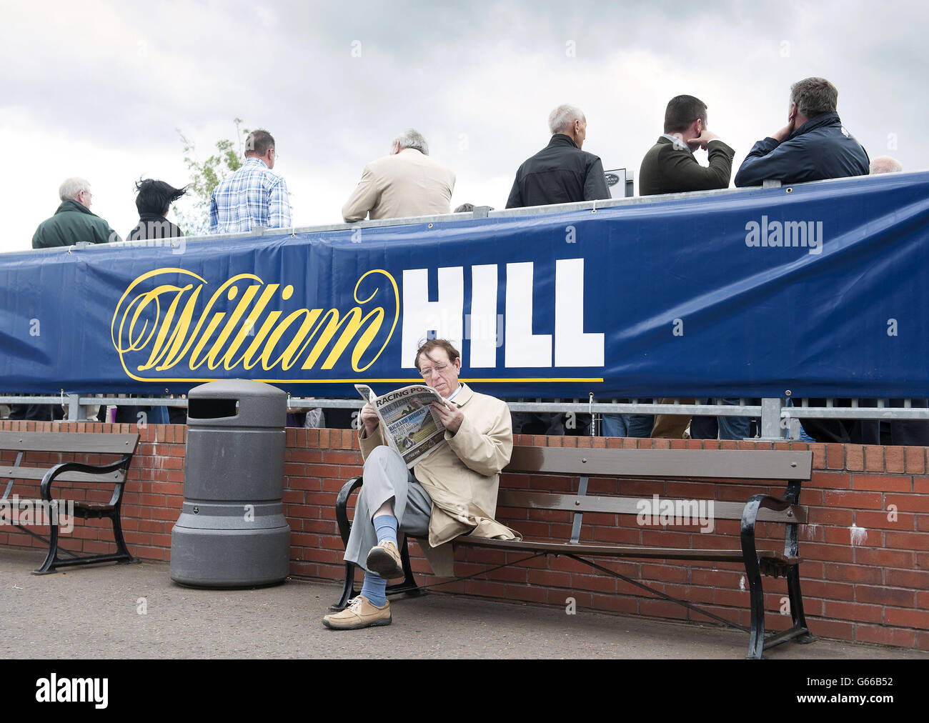 Reading the racing post hi-res stock photography and images - Alamy