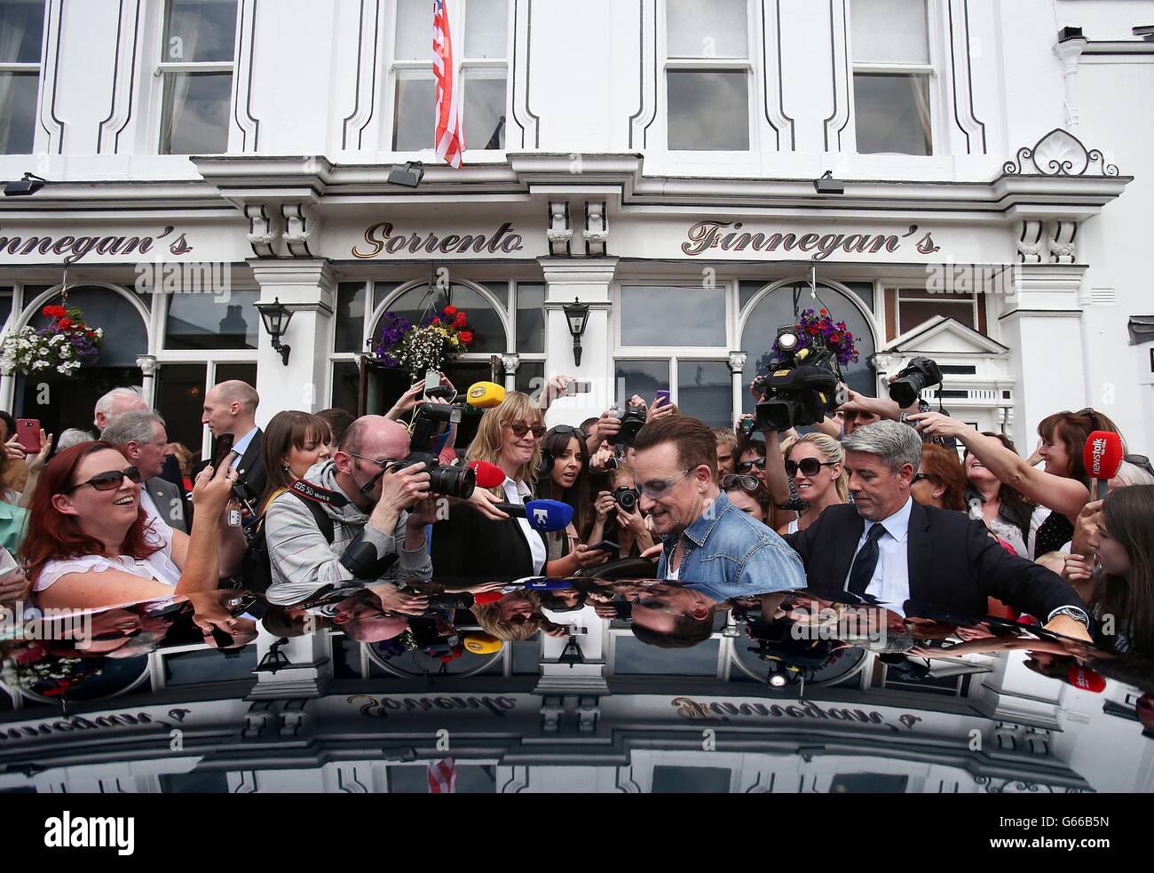 Irish musician Bono leaves Finnegan's Pub in Dalkey where he had lunch ...