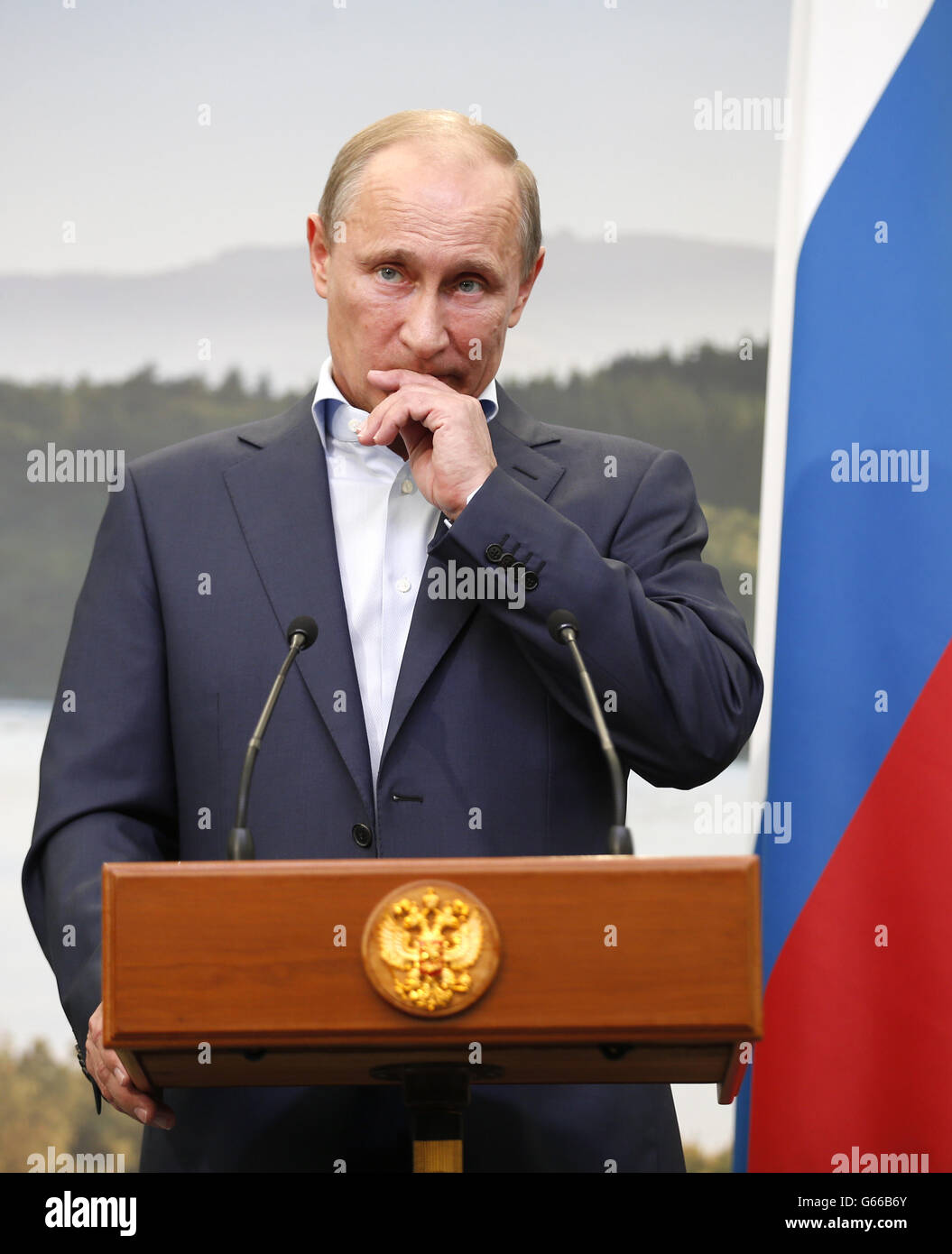 Russian President Vladimir Putin speaks during a media conference after ...