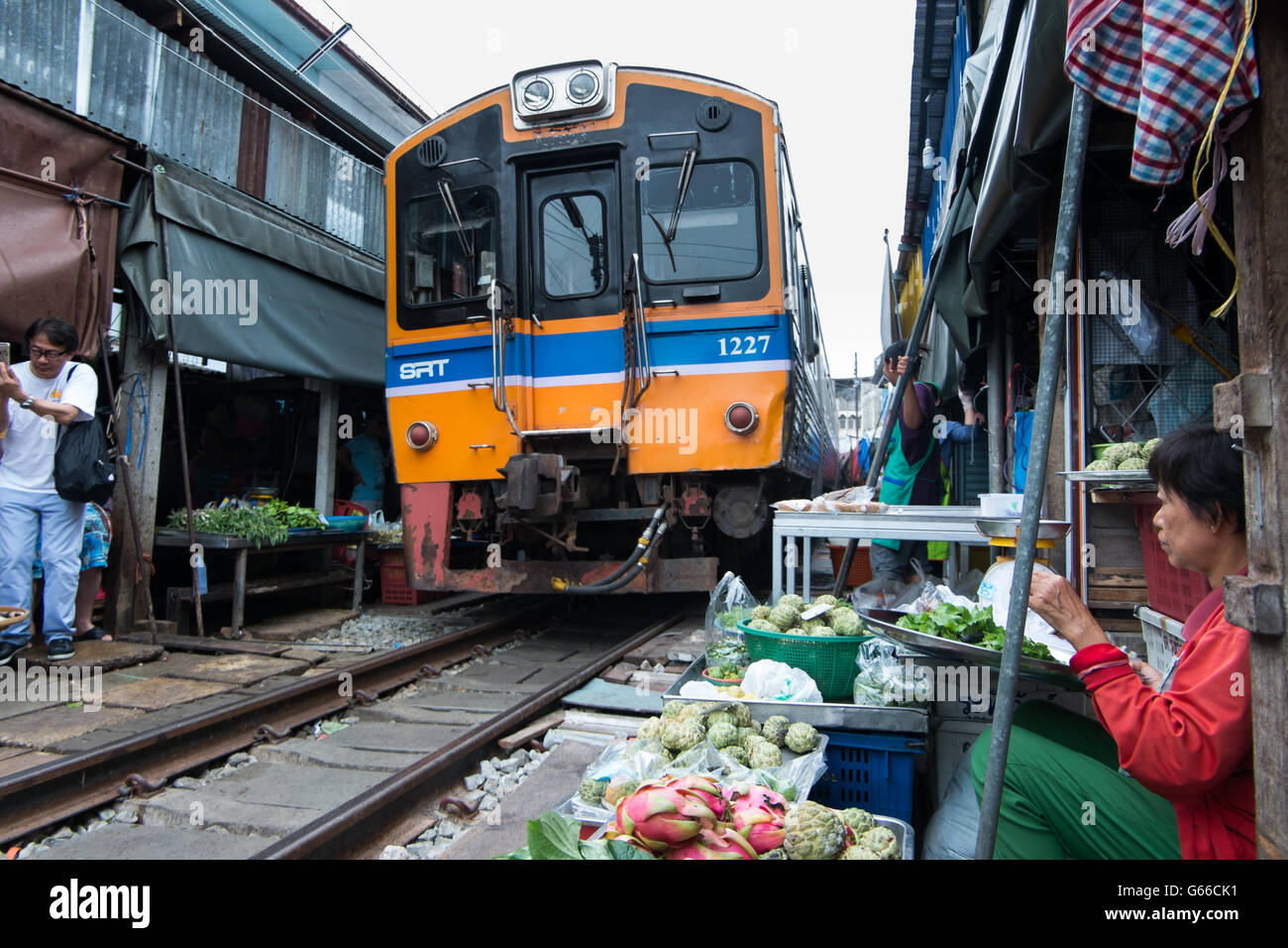 Train at Mae Klong railway track Stock Photo - Alamy