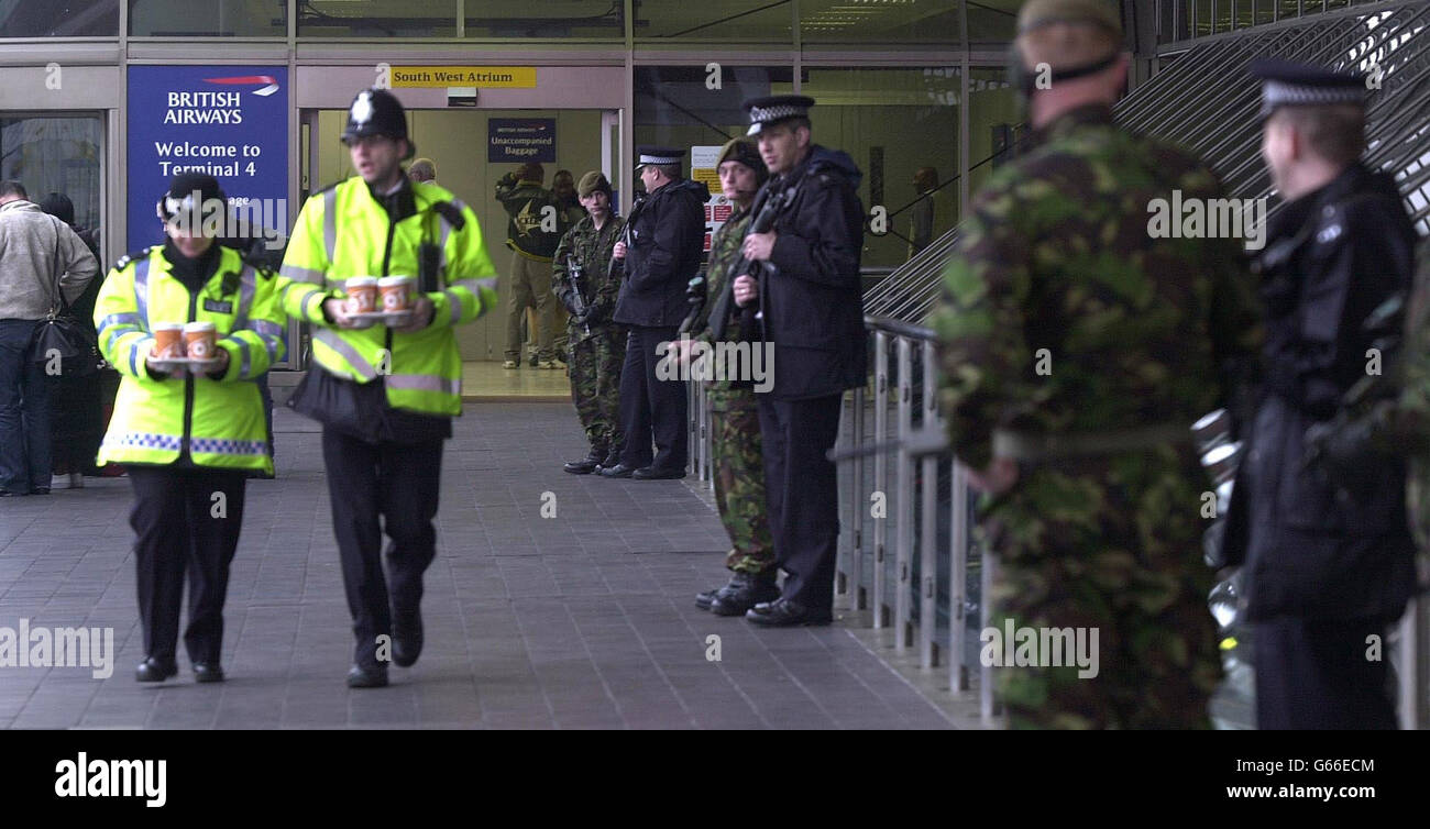 Police and soldiers guard terminal 4 at heathrow airport hi-res stock photography and images - Alamy