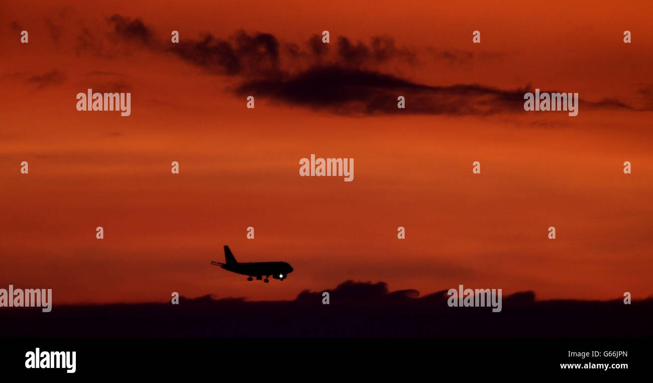 Sunset over Heathrow. A plane leaves as the sunsets over Heathrow ...