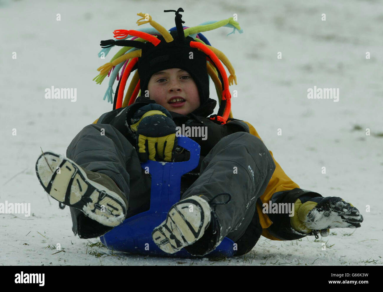 SLEDGING IN WINTER SNOW Stock Photo - Alamy