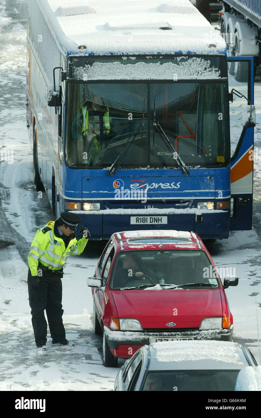 Police help drivers who are stuck on the A14 at Histon, Cambridge. Much ...
