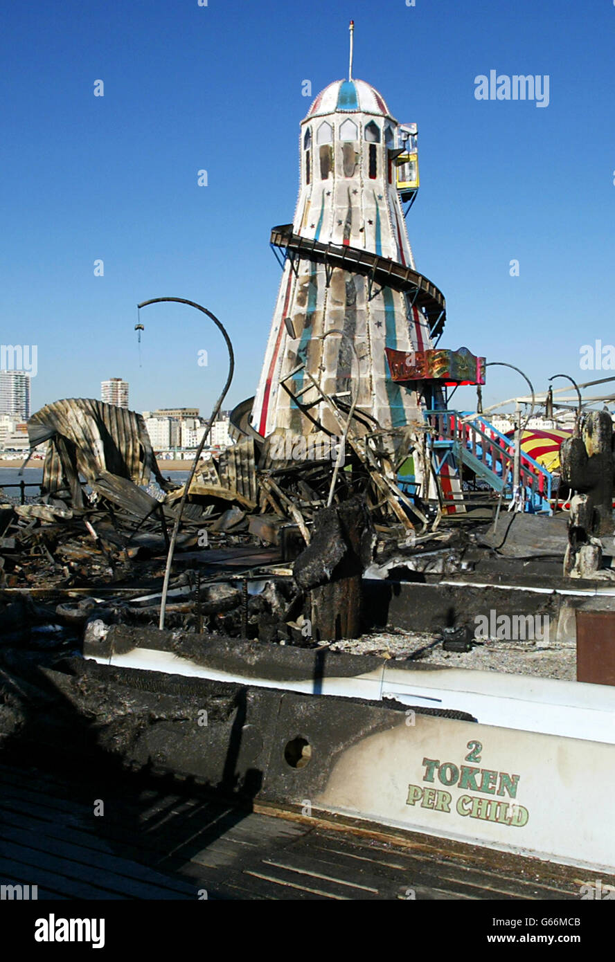 The charred remains of the ghost train ride and the helter skelter on ...