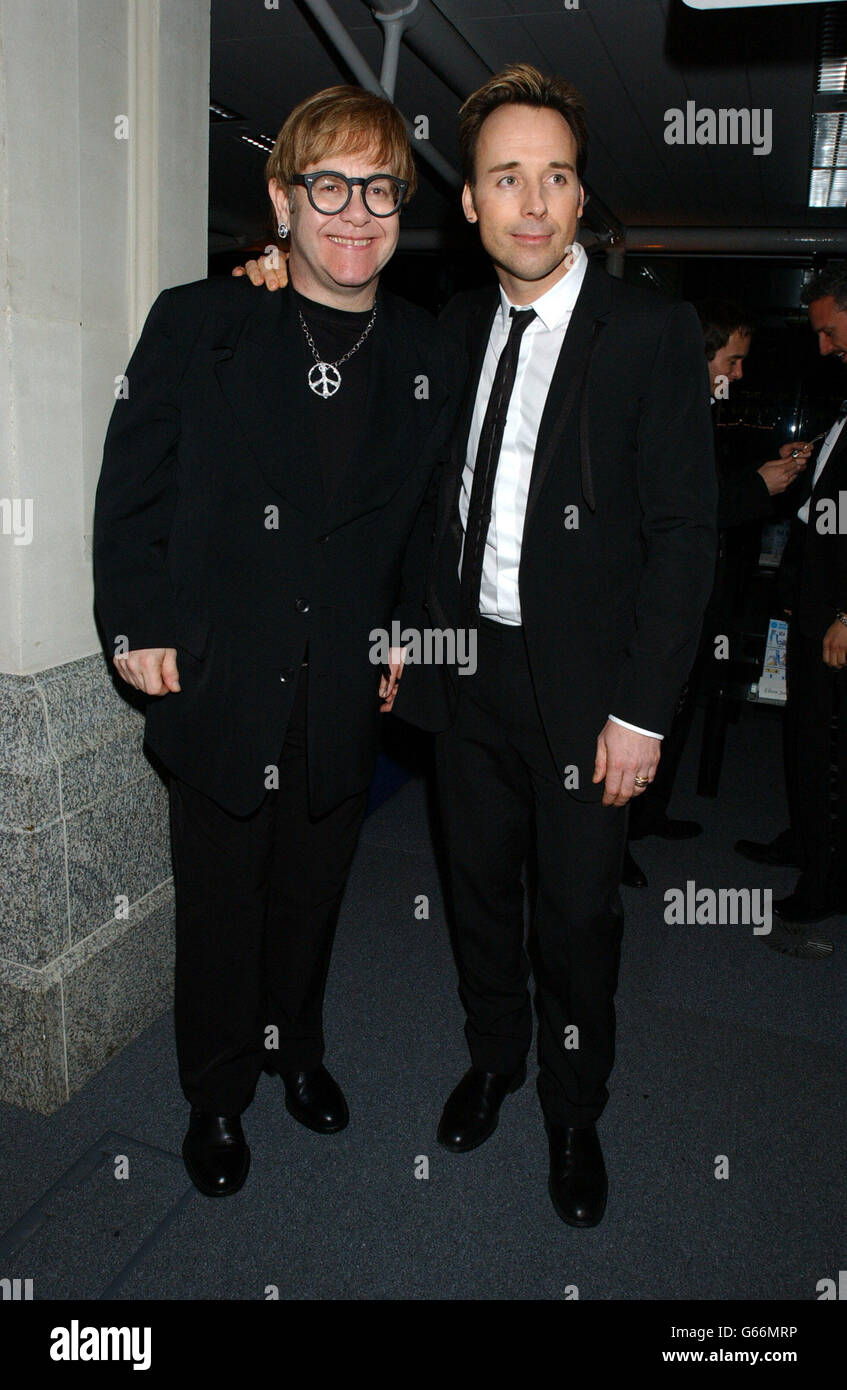 Sir Elton John and his partner David Furnish attend a party at The Old ...