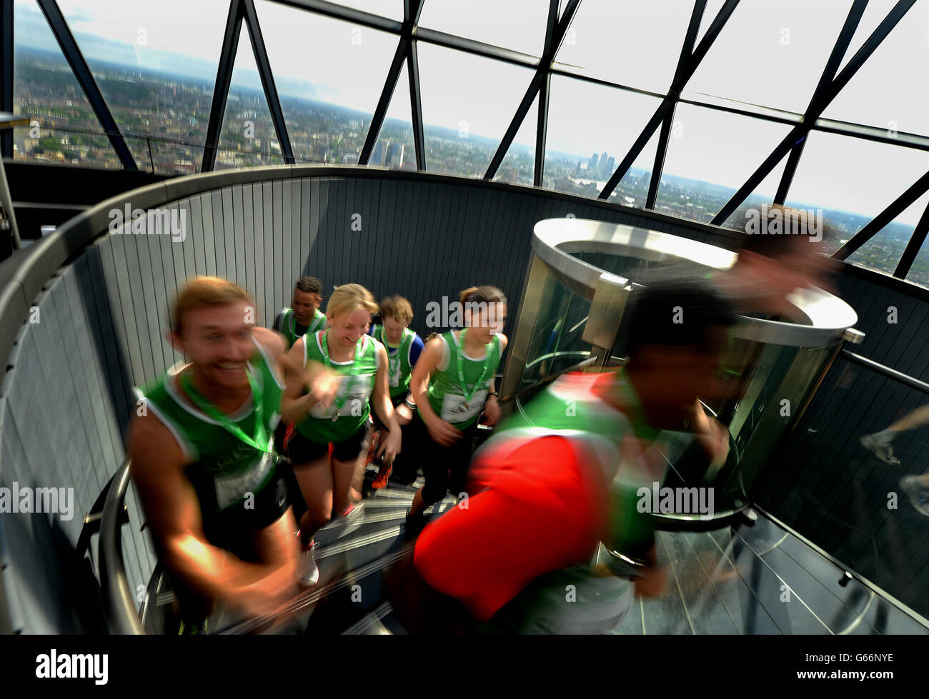 Runners compete during the Gherkin Challenge charity race, 38 floors up ...
