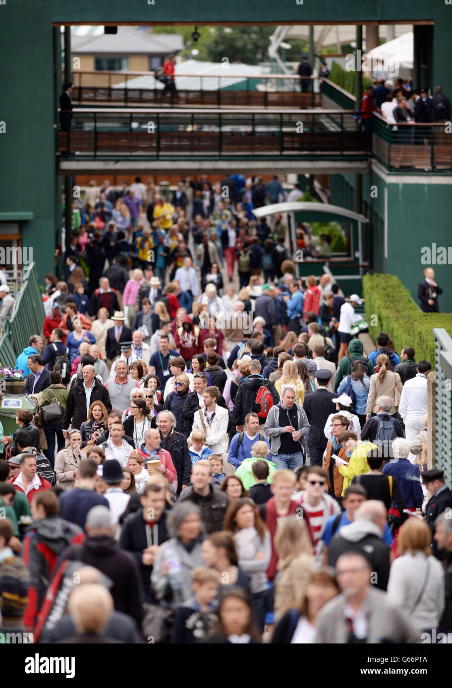 Tennis fans arrive during day one of the Wimbledon Championships at The ...