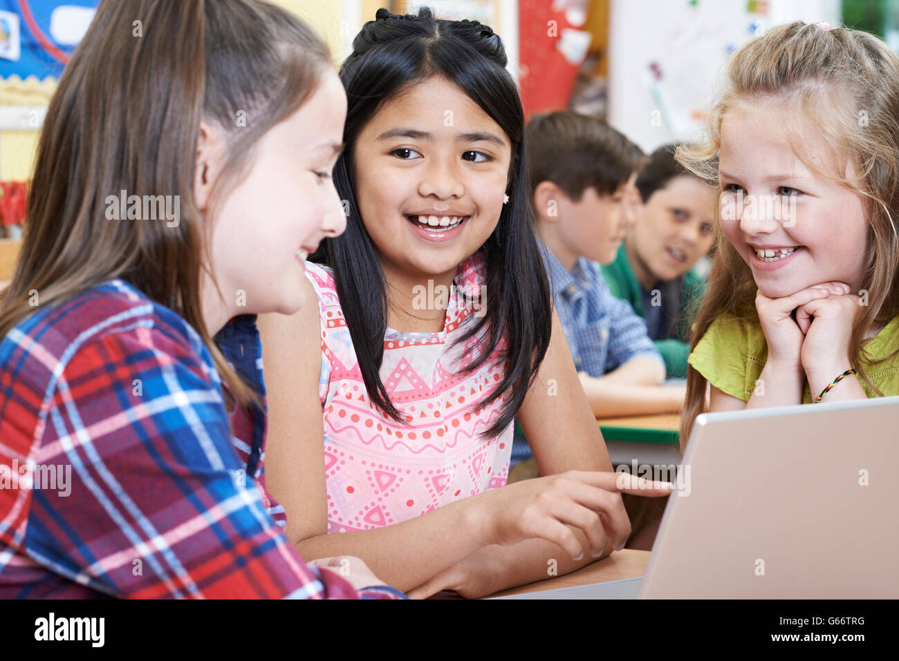 Children working together on computer hi-res stock photography and ...