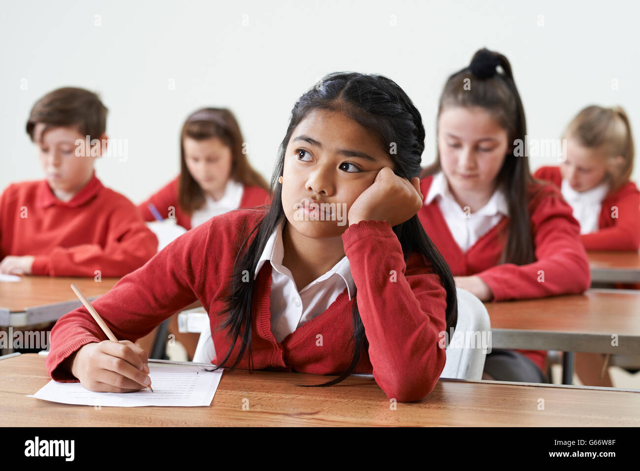 Female Pupil Finding School Exam Difficult Stock Photo - Alamy