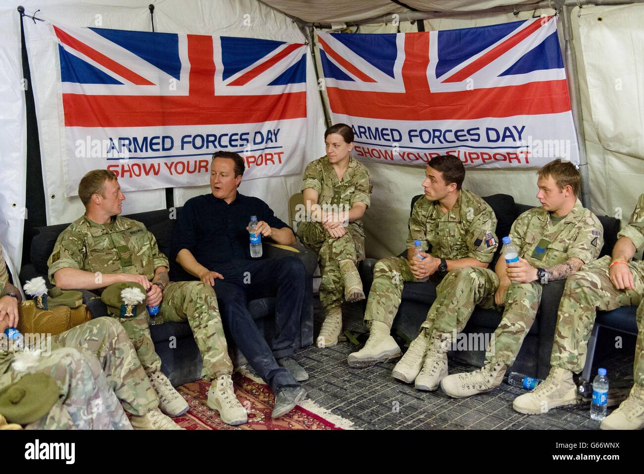 Prime Minister David Cameron speaks with troops during an Armed Forces ...