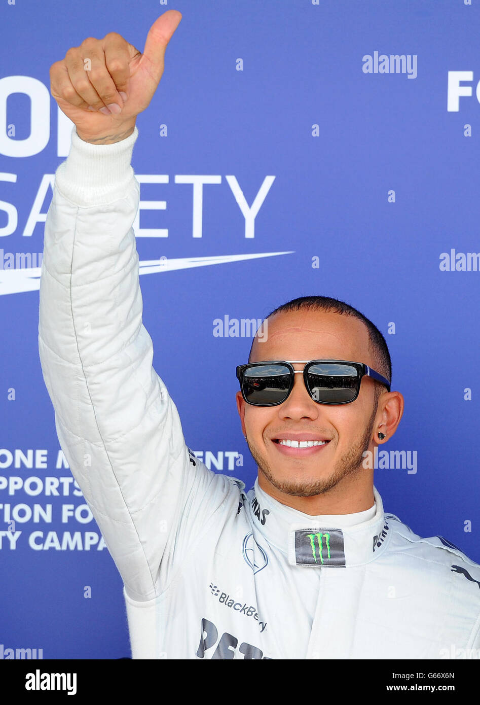 Mercedes' driver Lewis Hamilton celebrates after taking pole during ...