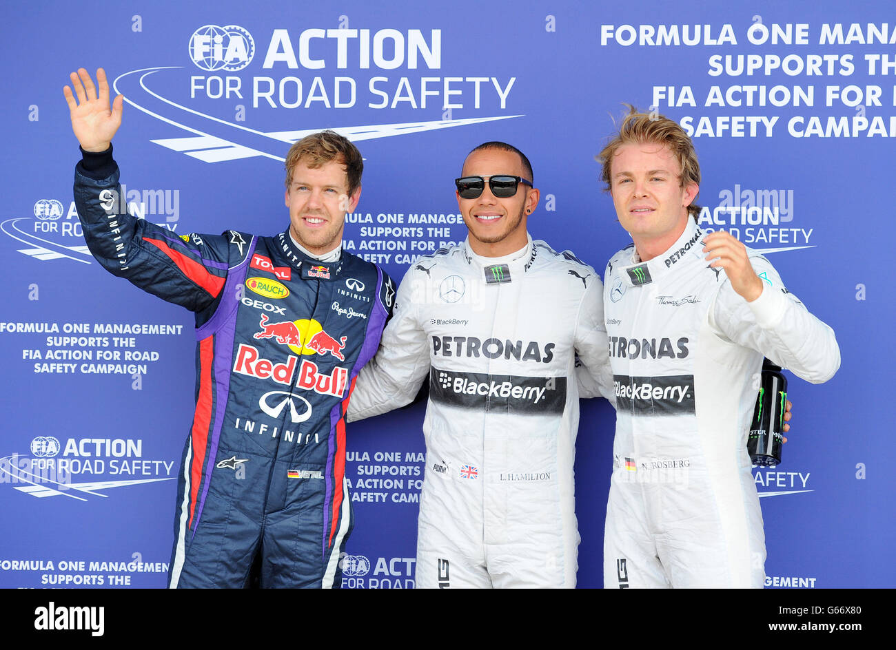 Mercedes AMG Petronas driver Lewis Hamilton (centre) celebrates with ...
