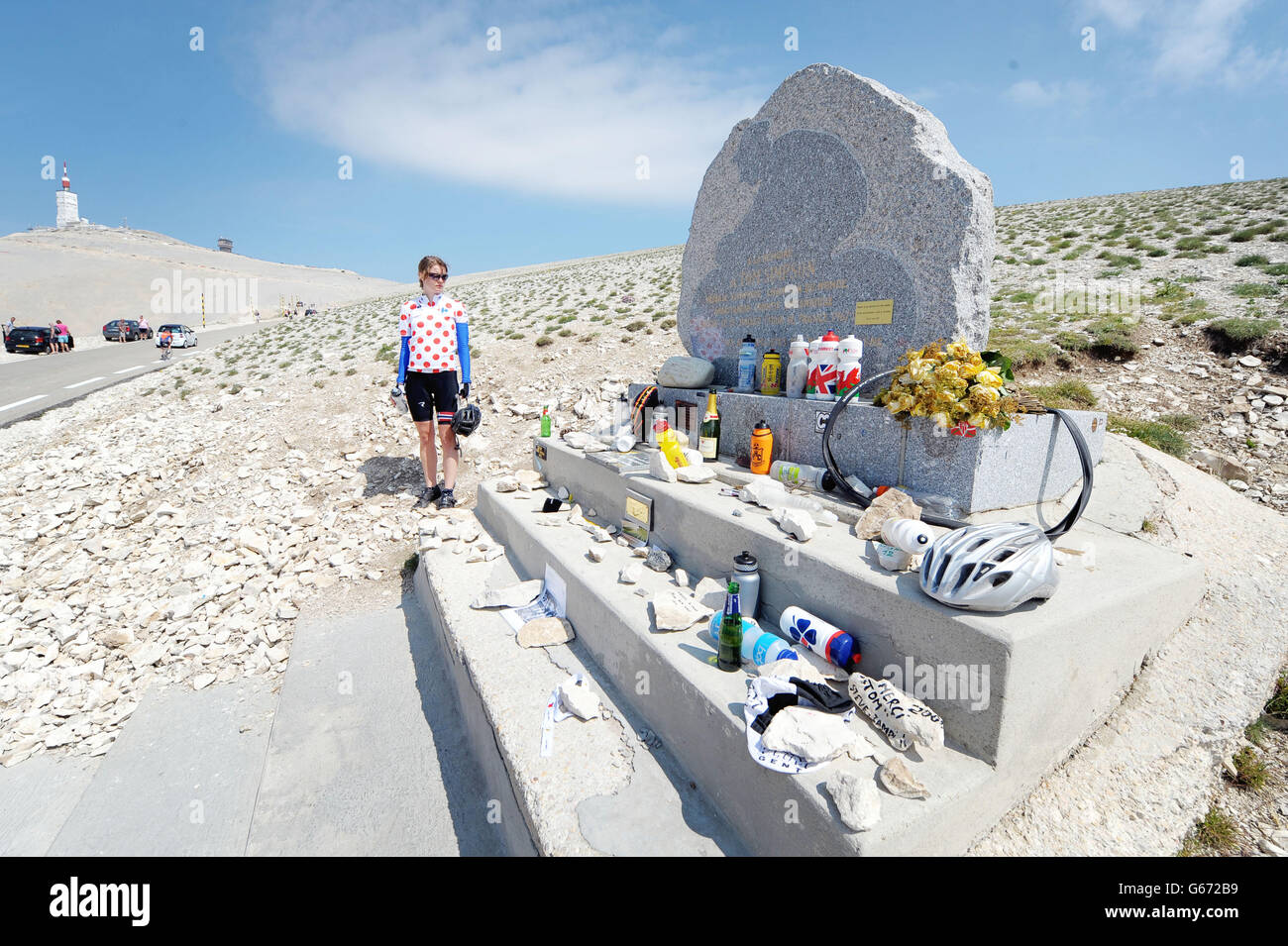 A woman views the Tom Simpson memorial 1km from the finish of tomorrow ...