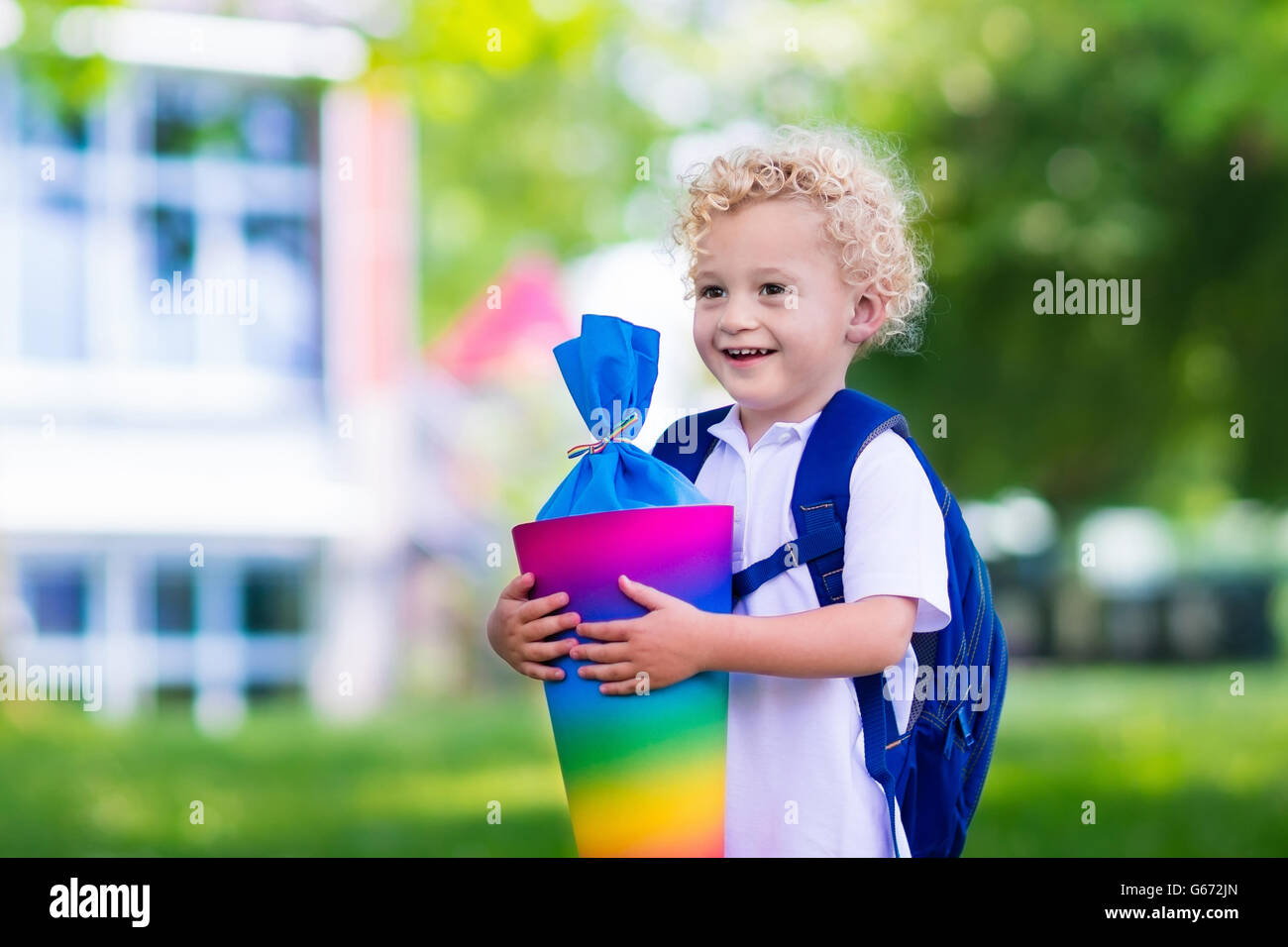 Happy child holding traditional German candy cone on first school day ...