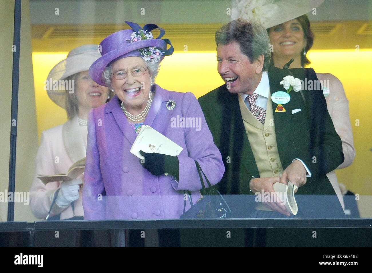 Britain's Queen Elizabeth II with her racing manager John Warren after ...