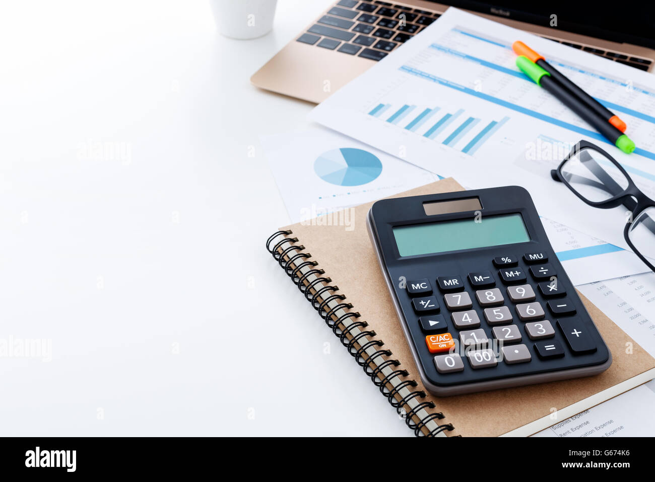 Financial work background with calculator and financial chart on laptop ...