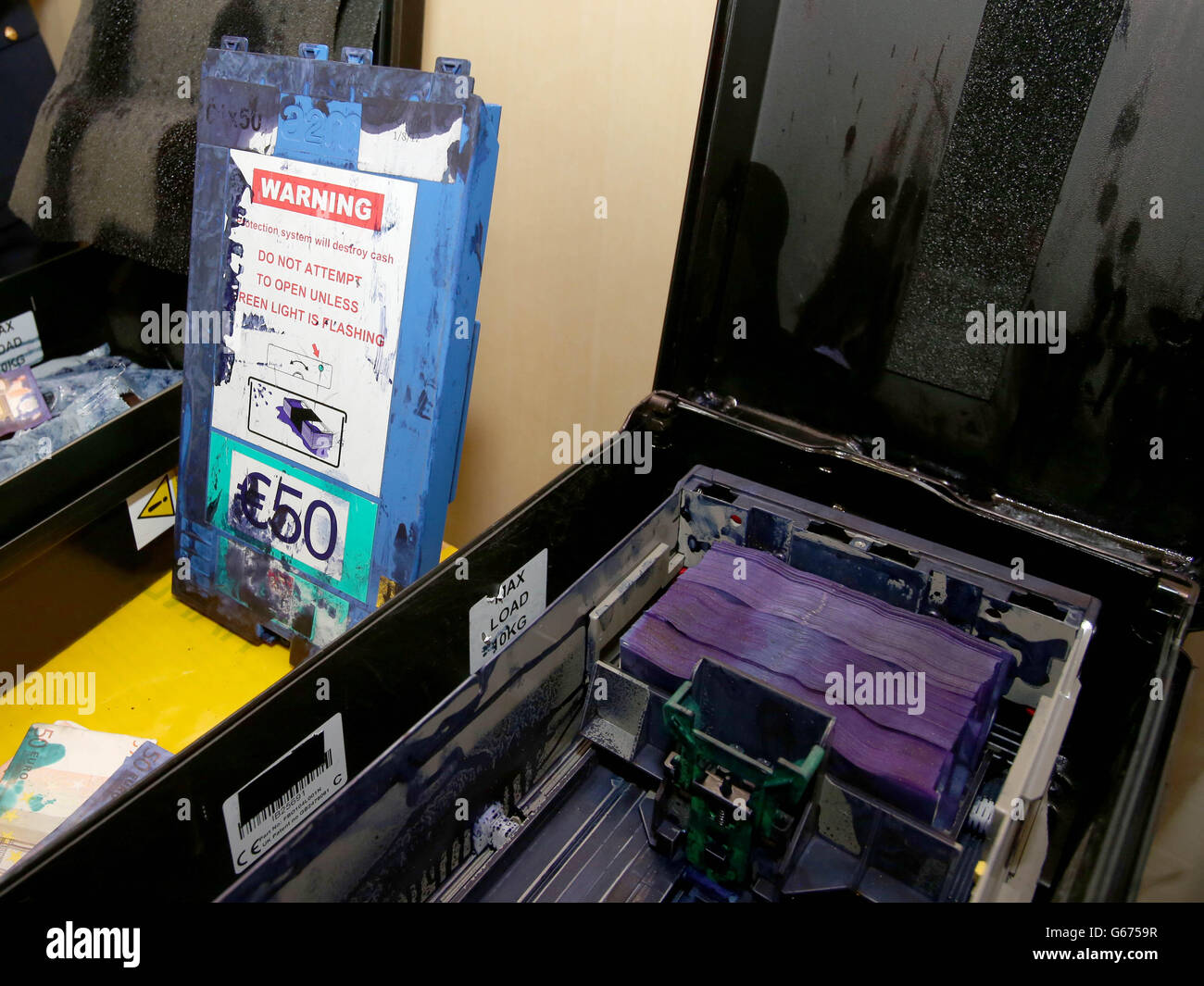 Ink stained bank notes from stolen cash in transit boxes on display at ...