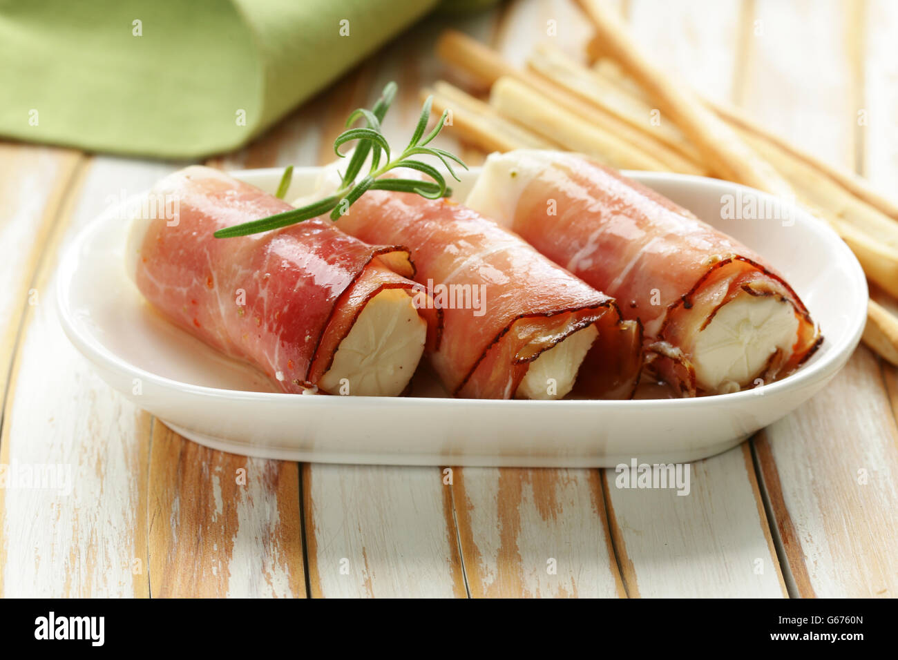 Italian appetizer soft cheese wrapped in parma ham Stock Photo - Alamy