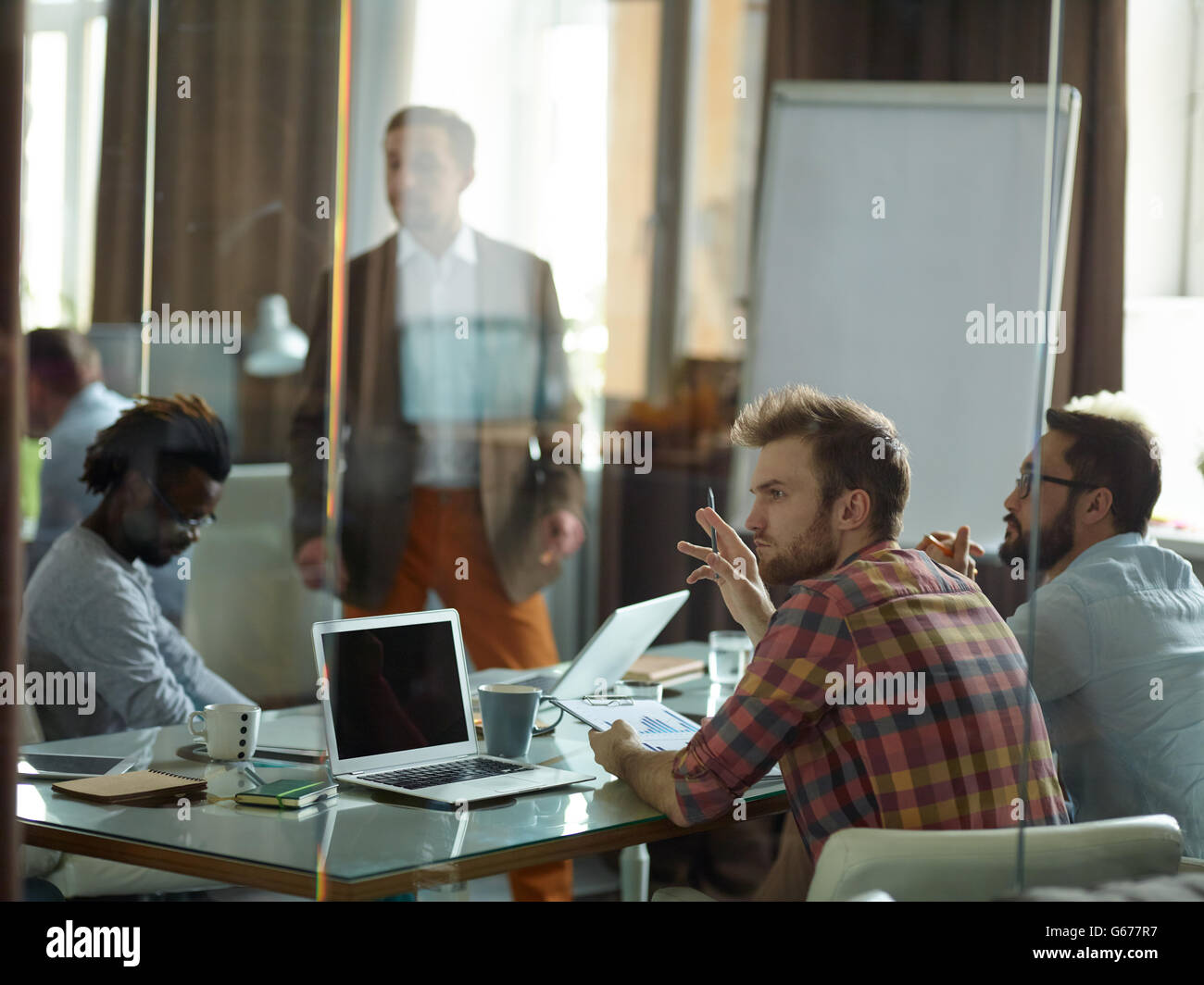 Young business colleagues putting hi-res stock photography and images ...