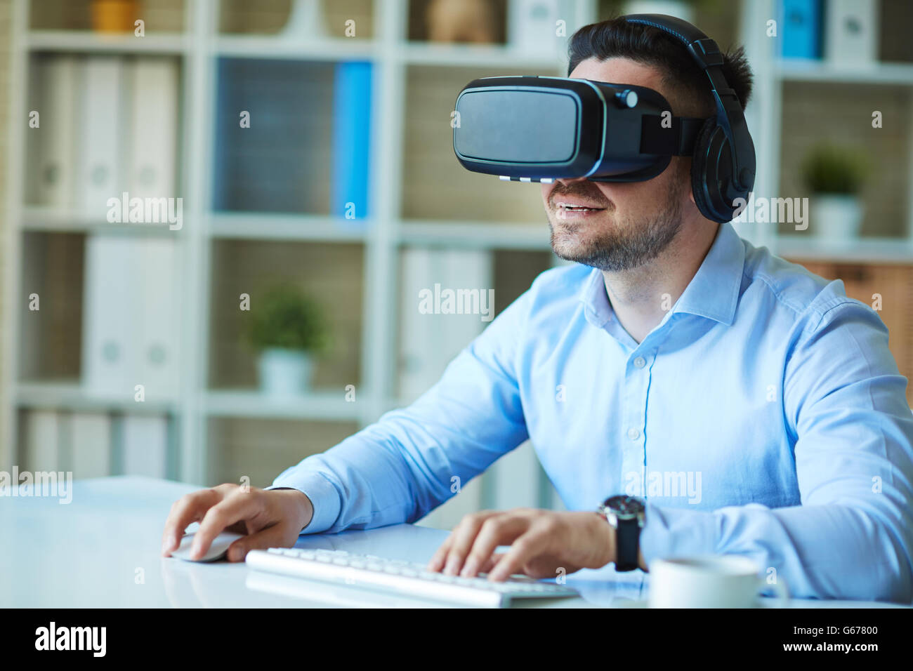 Gaming at workplace Stock Photo - Alamy