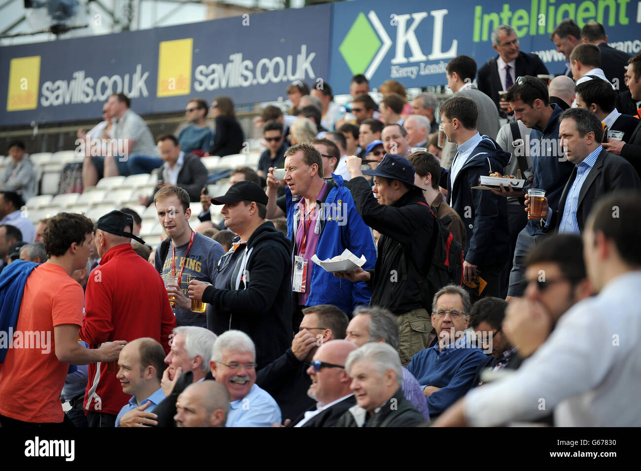 Spectators have food drink inside the kia oval the match hi-res stock ...