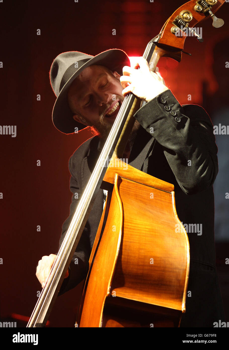 Ted Dwane of Mumford & Sons performing on the Pyramid Stage at the ...