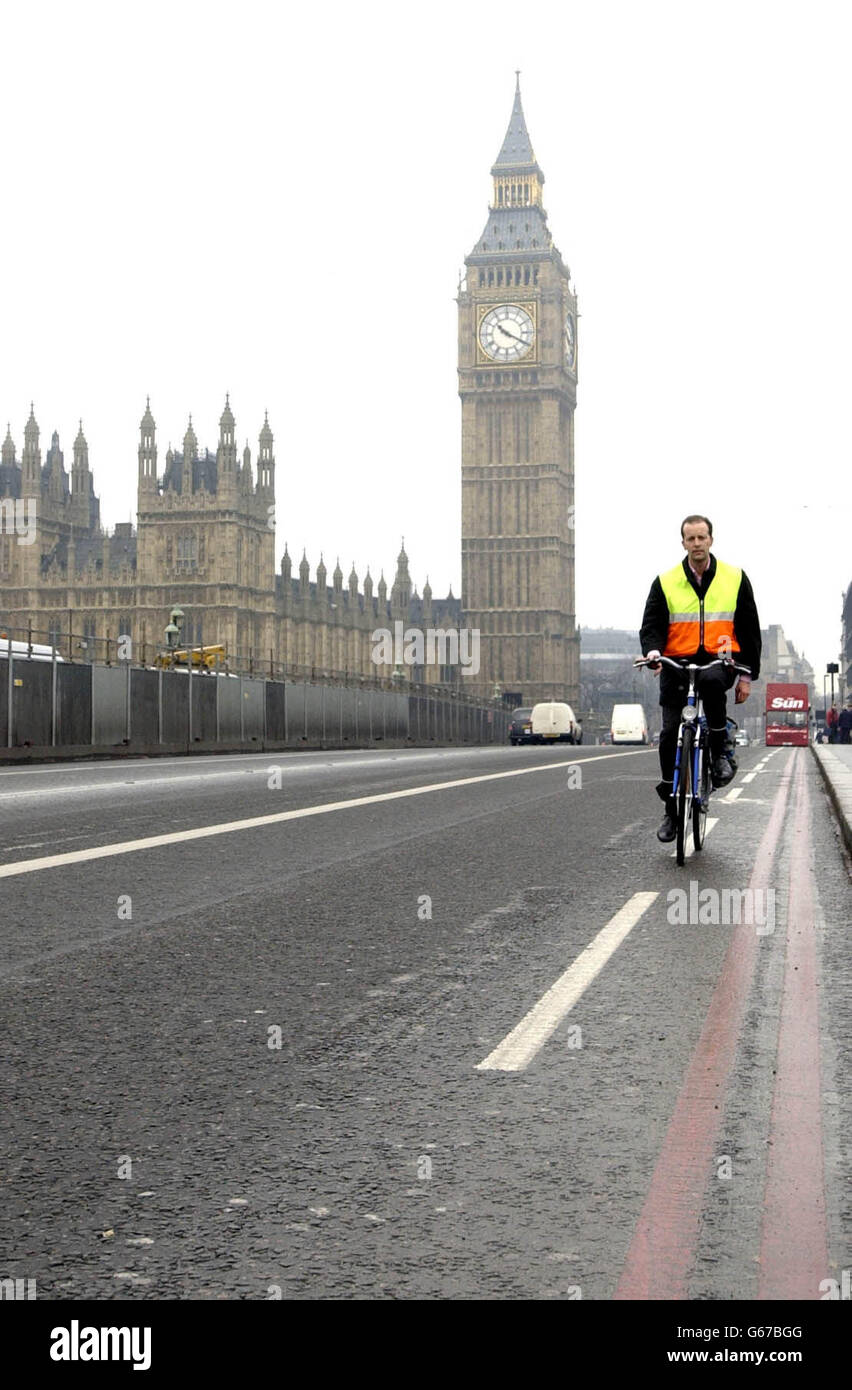 A man cycles across Westminster Bridge in central London. Motorists ...