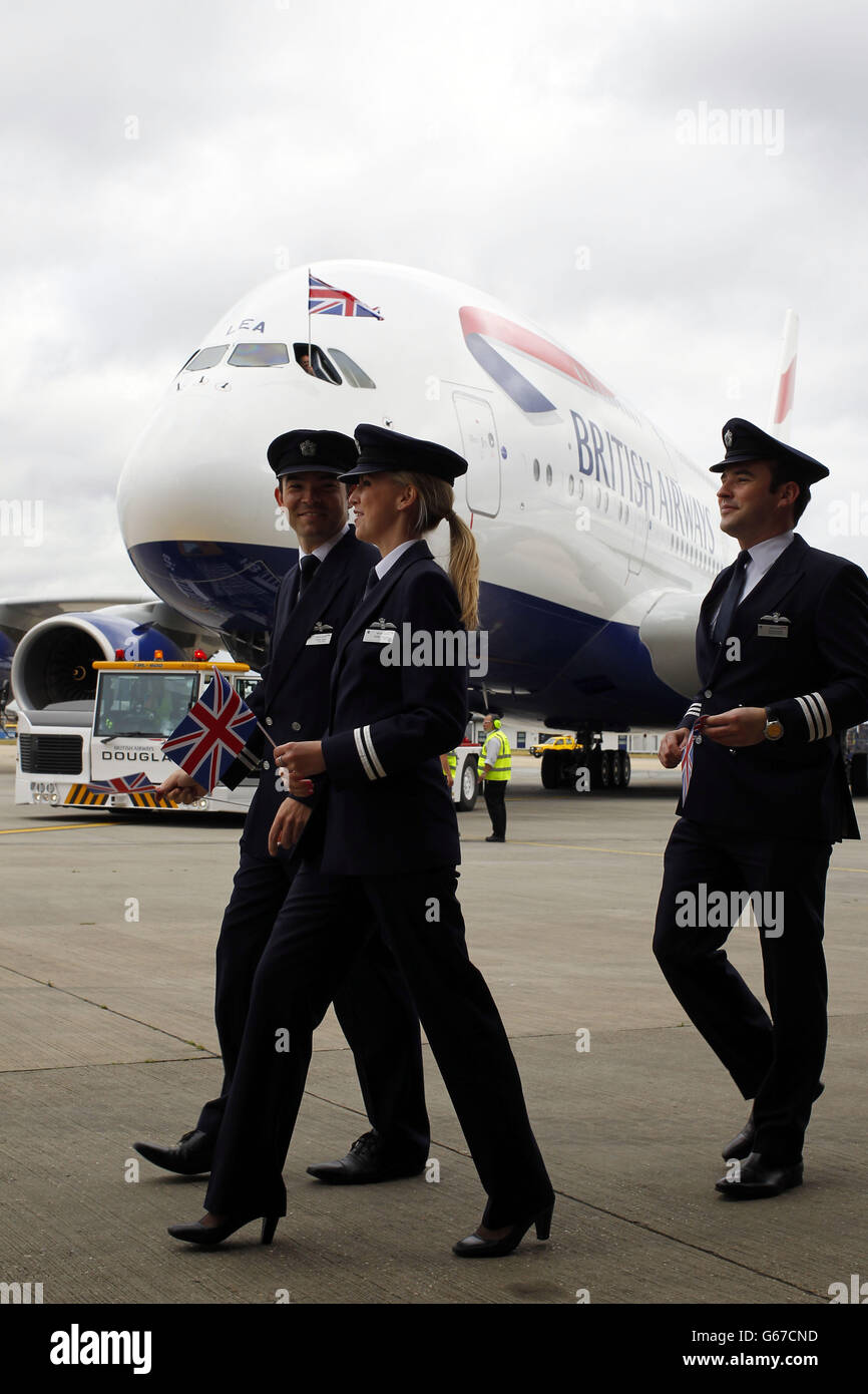 British Airways pilots walk in front of a British Airways Airbus A380 ...