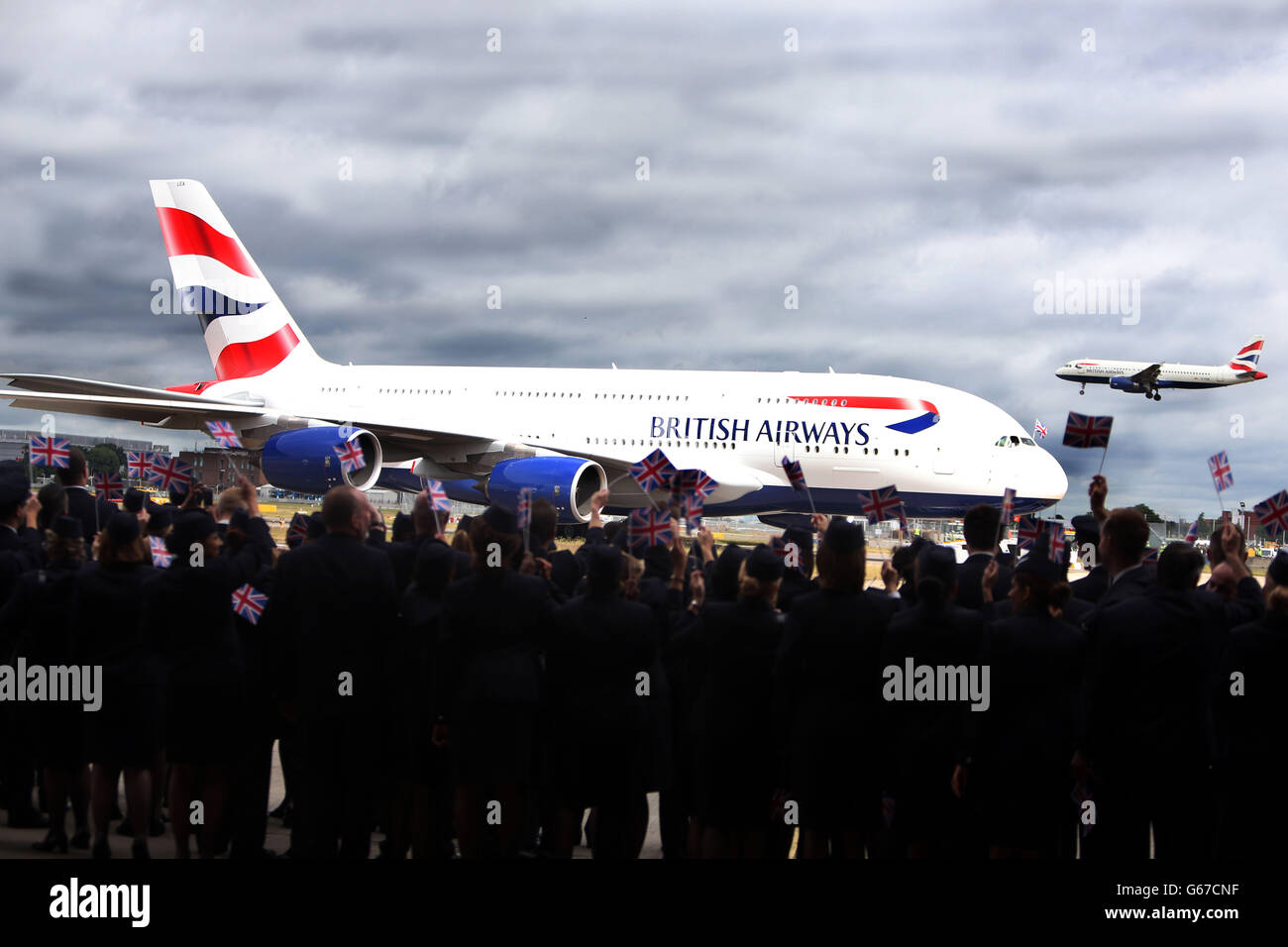 British airways staff look at a british airways airbus a380 hi-res ...