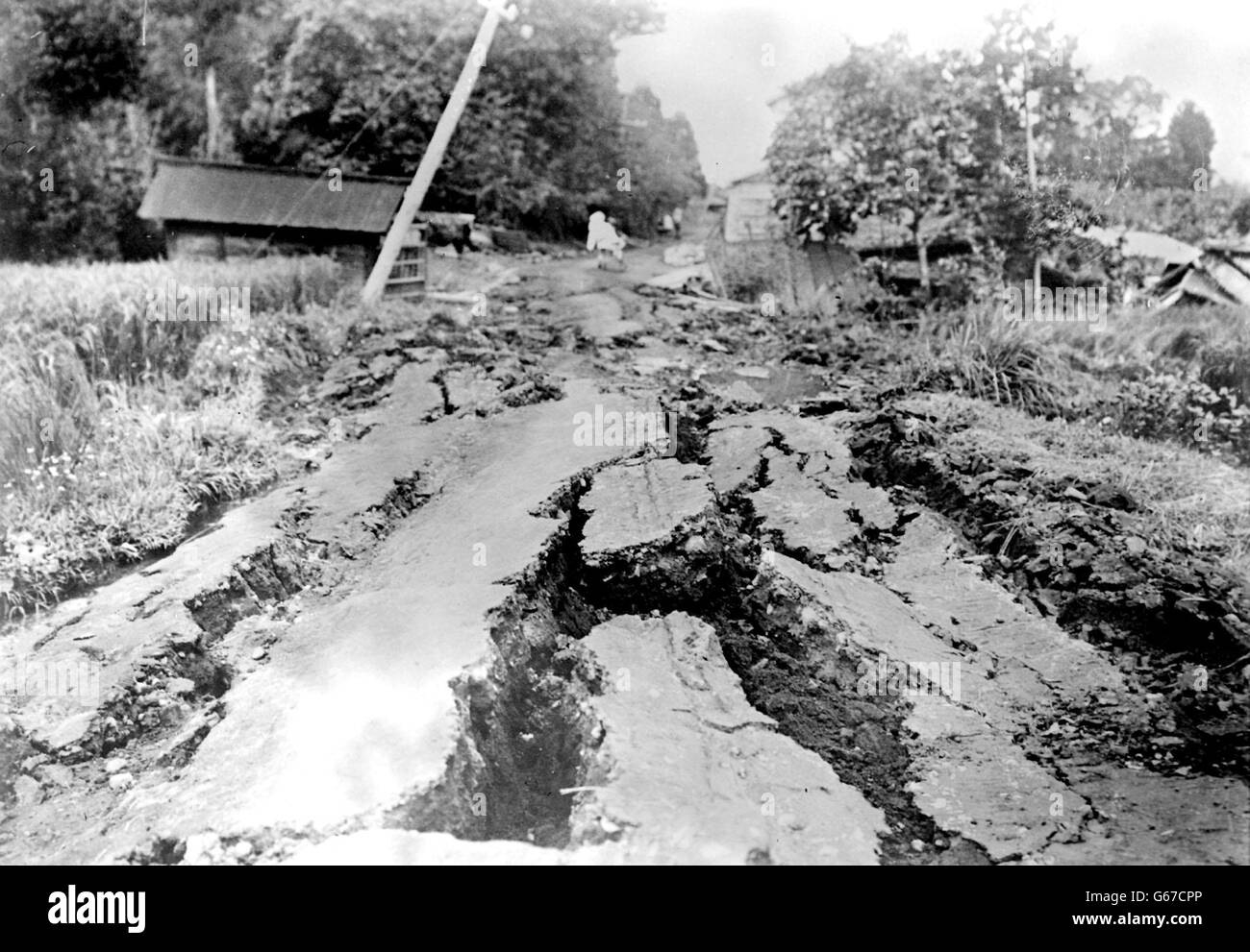 Huge fissures in a country road in the Hakone mountain region north of ...