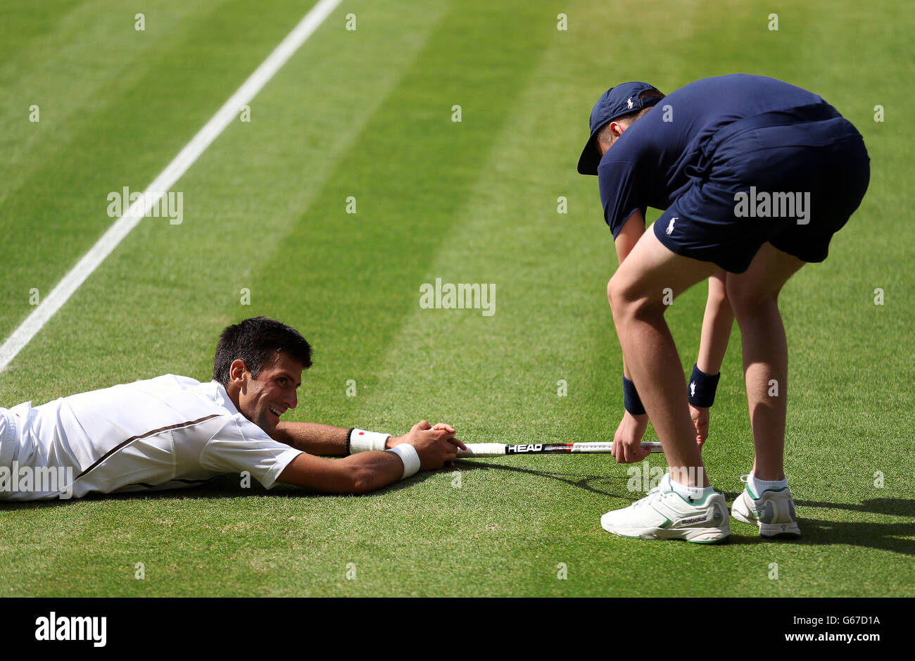 Novak djokovic stretching hi-res stock photography and images - Alamy