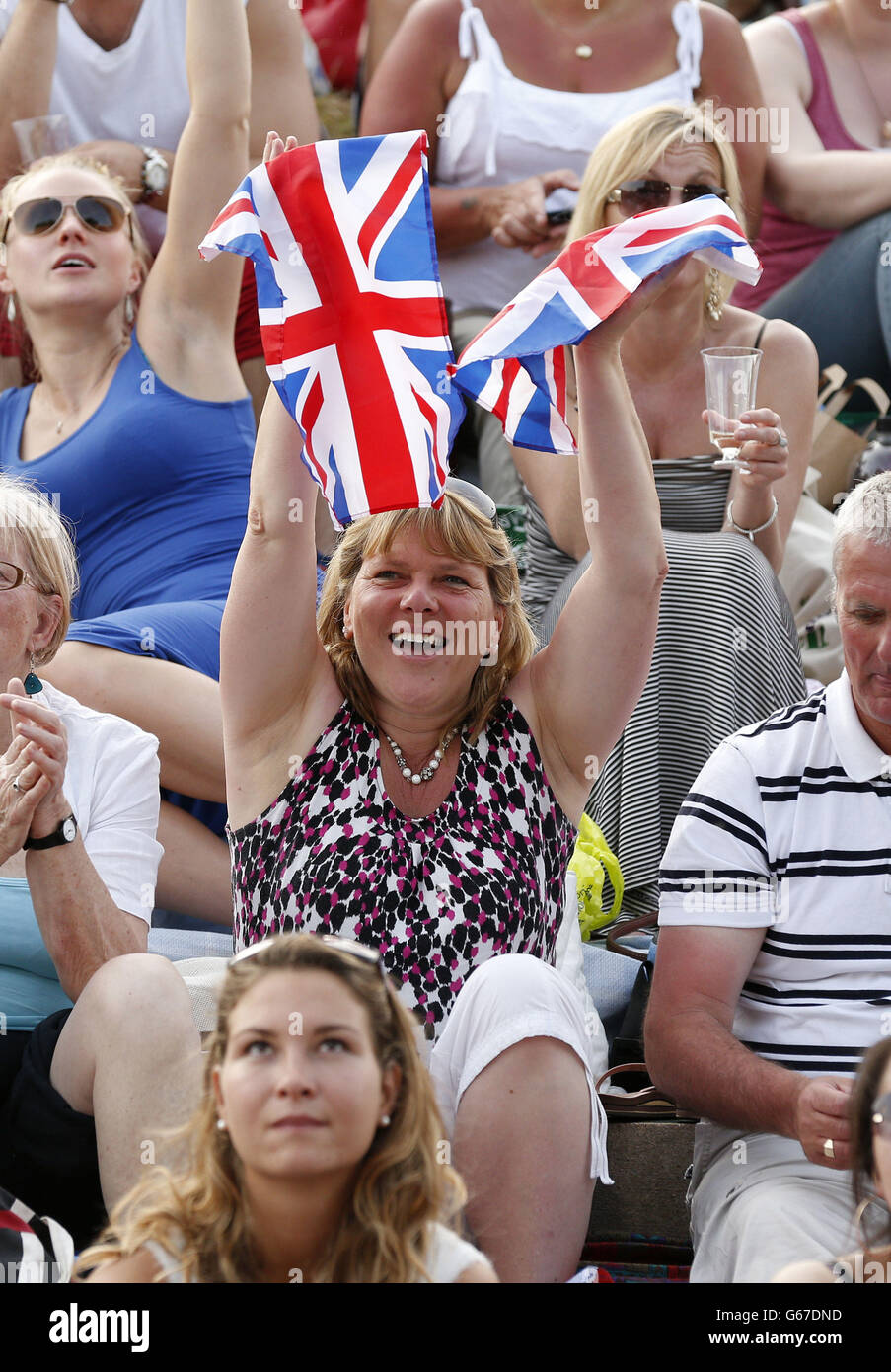 Fans on Murray Mount watch the big screen as Great Britain's Andy ...