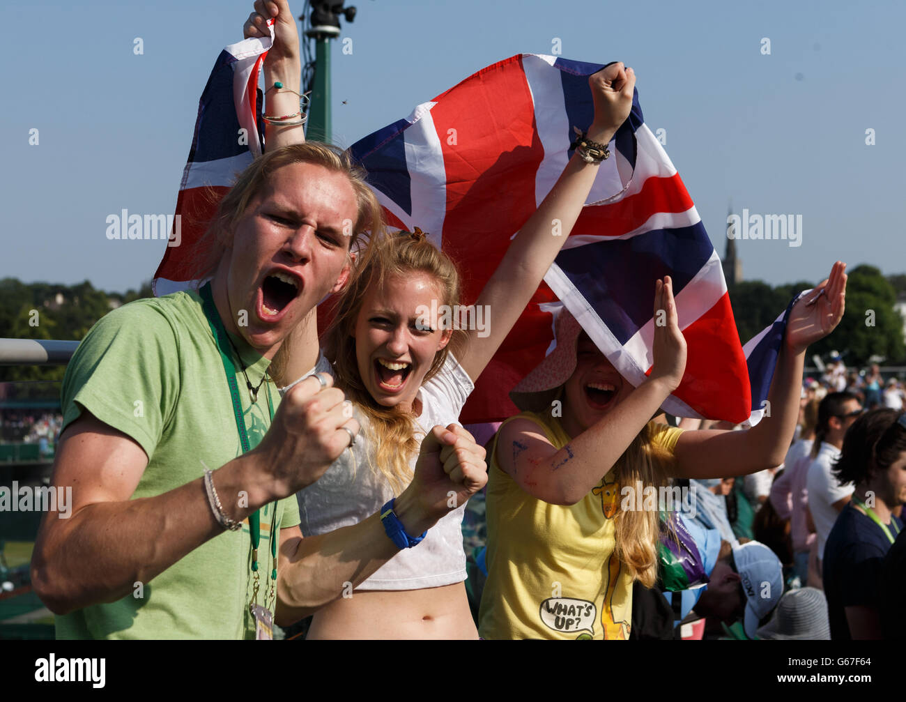 Fans of Great Britain's Andy Murray celebrate during day thirteen of ...
